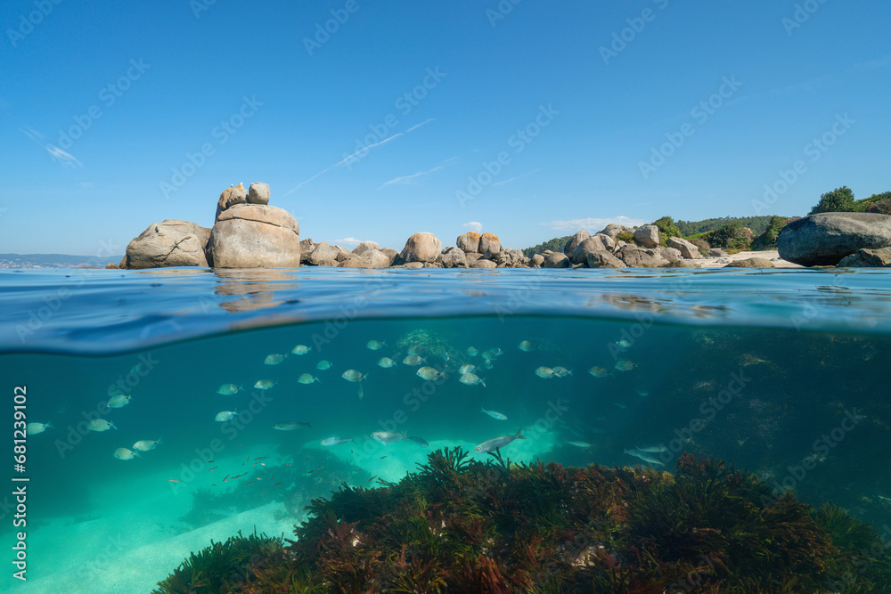 Spain Atlantic ocean seascape, coastline with boulders and fish ...