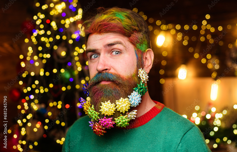 Bearded man with decorated beard for New Year party. Merry Christmas ...