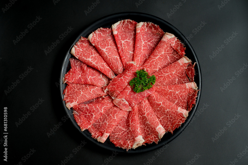 Sliced beef Japanese style beef slices Sliced beef in a black plate on ...