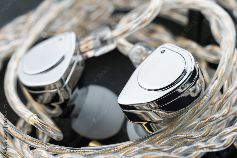 In ear monitor on a tablature background. Custom in-ear monitors with ...