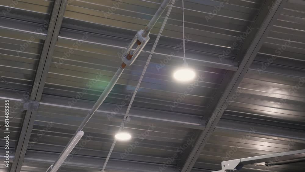 Lighting in a large modern service station with a metal roof. Car ...