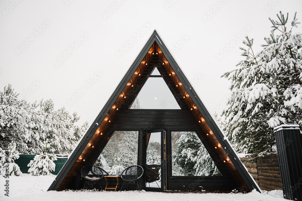 Winter house in mountain snow landscape at Christmas. Wooden cottage in ...