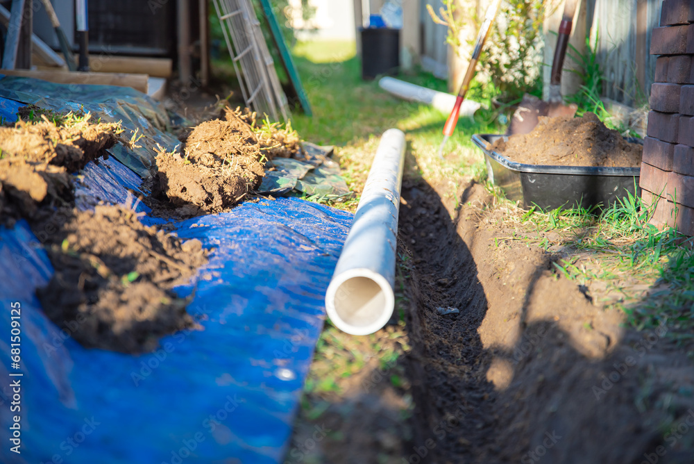 Side of house drainage system installation, PVC pipe ready to laying ...