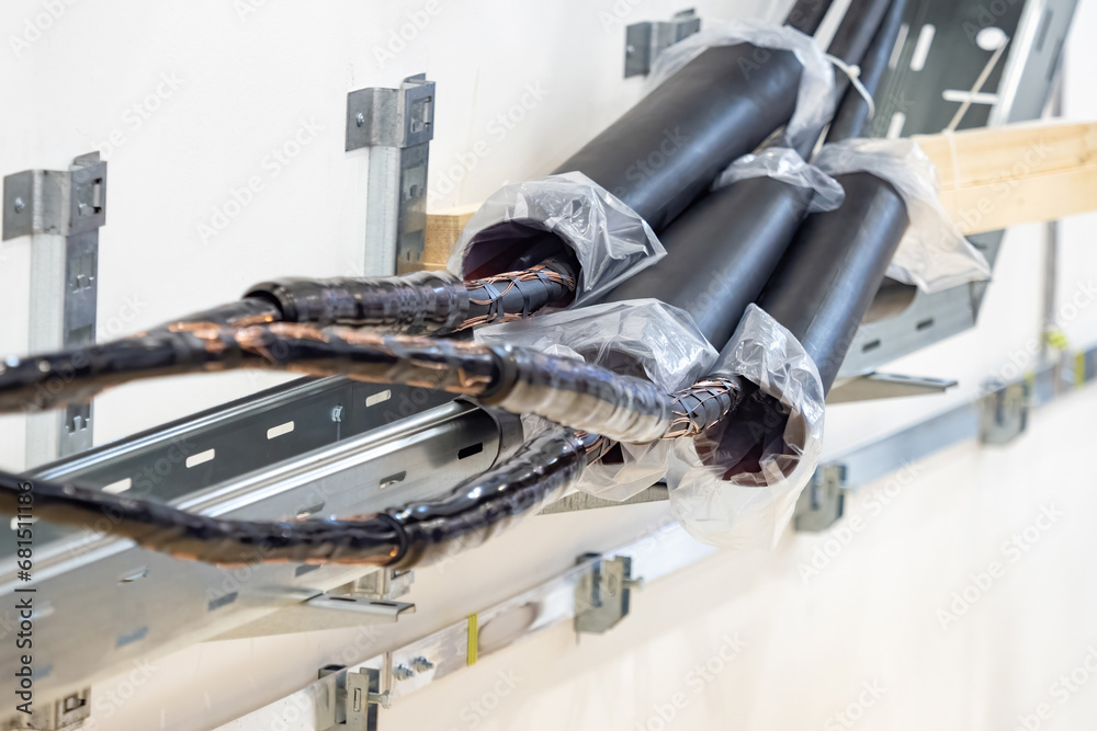 High voltage electrical cables. Power wires are wrapped with black ...