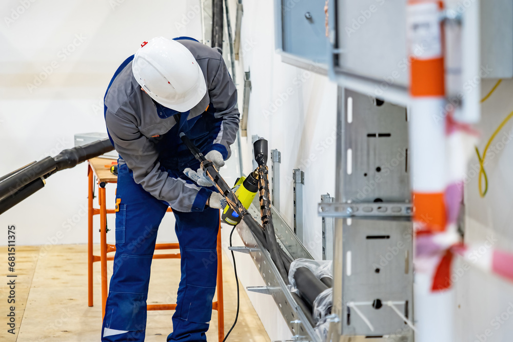 Electrical engineer at work. Man is doing electrical work. Guy ...