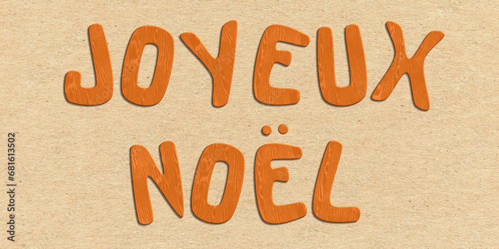 Joyeux Noël écrit en lettres de bois découpé et posé sur du tissu ...
