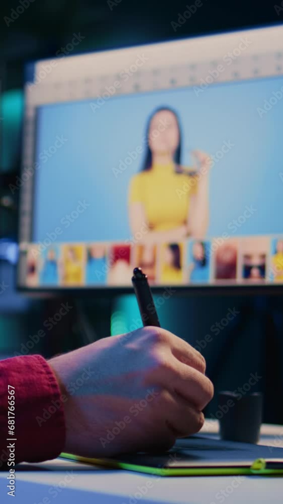 Vertical video Expert photo editor browsing through photoshoot images ...