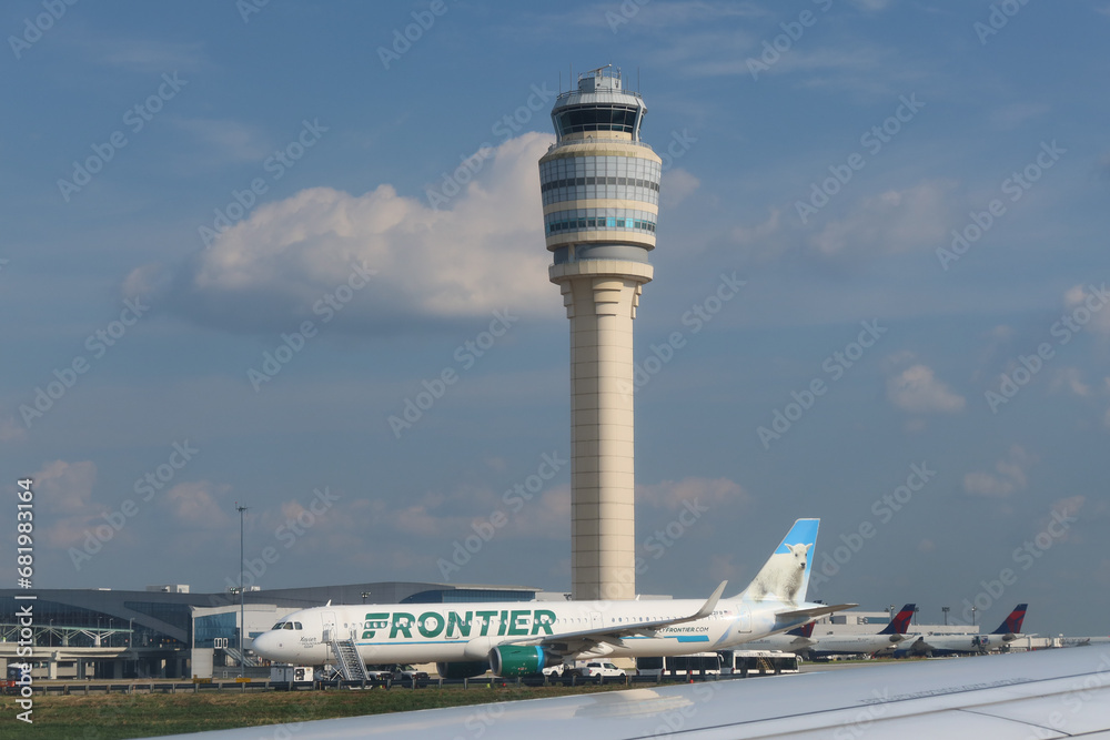 Frontier Airlines aircraft and the control tower at Hartsfield-Jackson ...
