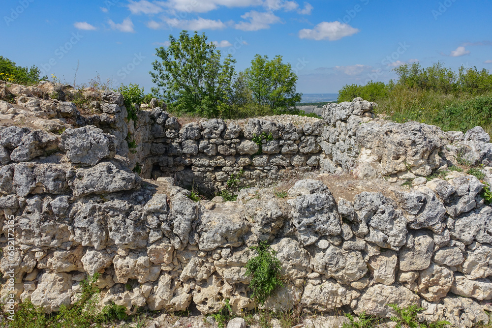 Ancient buildings cave fortress city Mangup-Kale, sunny day. Mountain ...