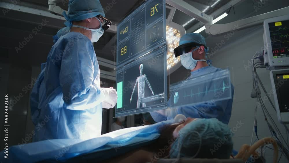 Surgeons operate patient in modern hospital operating room wearing AR ...