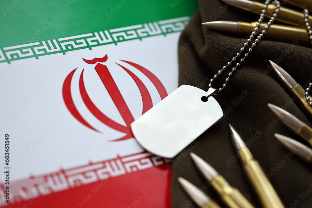 Many rifle bullets and dog tags with flag of Islamic Republic of Iran ...