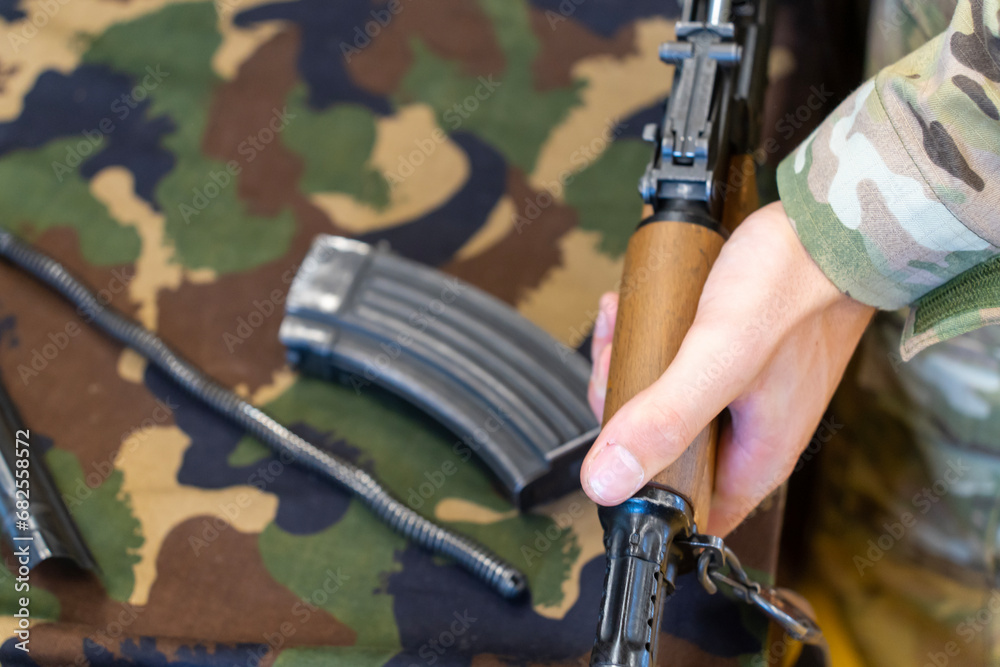 Poster Soldier assembling old AK-47 Kalashnikov assault rifle – Wall ...