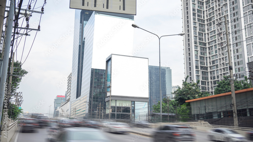 Advertising signs next to tall buildings in the city center Located ...