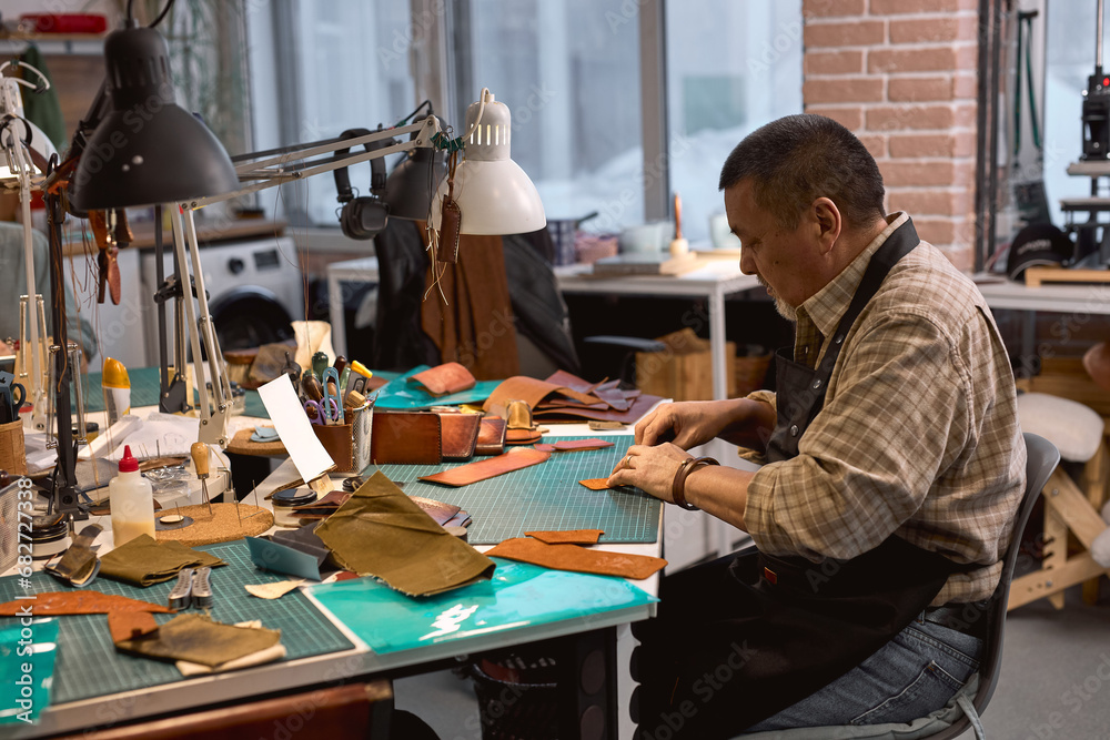 old handsome bearded man learning to sew pure, side view portrait ...