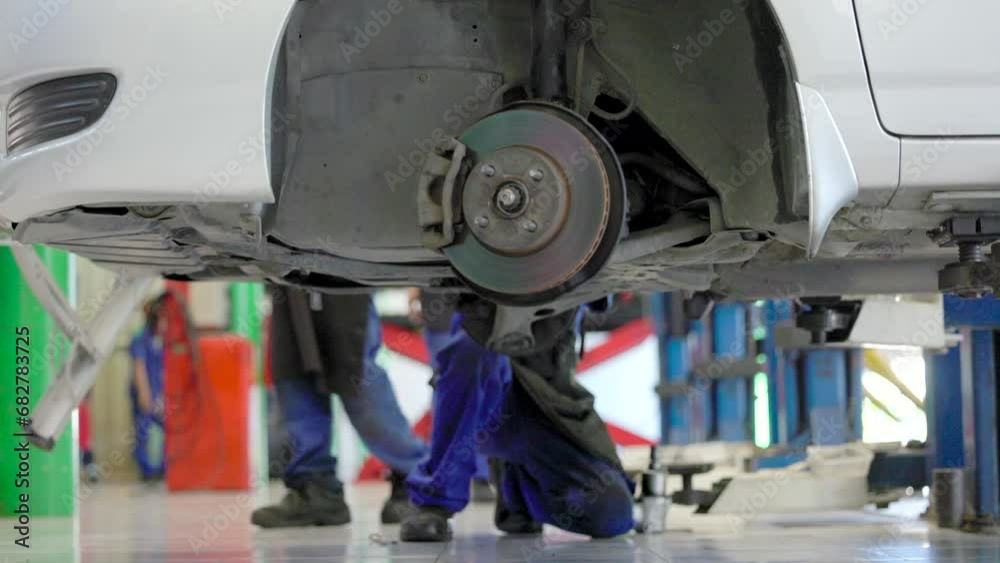 Professional mechanic changing a new tire. Disc brake on car in process ...