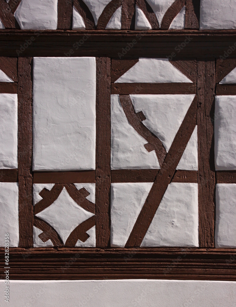 Architectural detail of a half-timbered facade with wooden beams on a ...