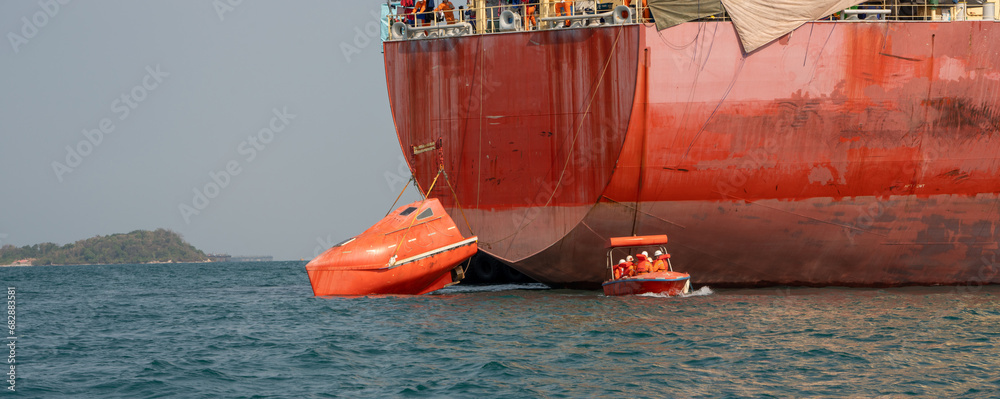 Watertight lifeboat test. Port state control. Lowering orange totally ...