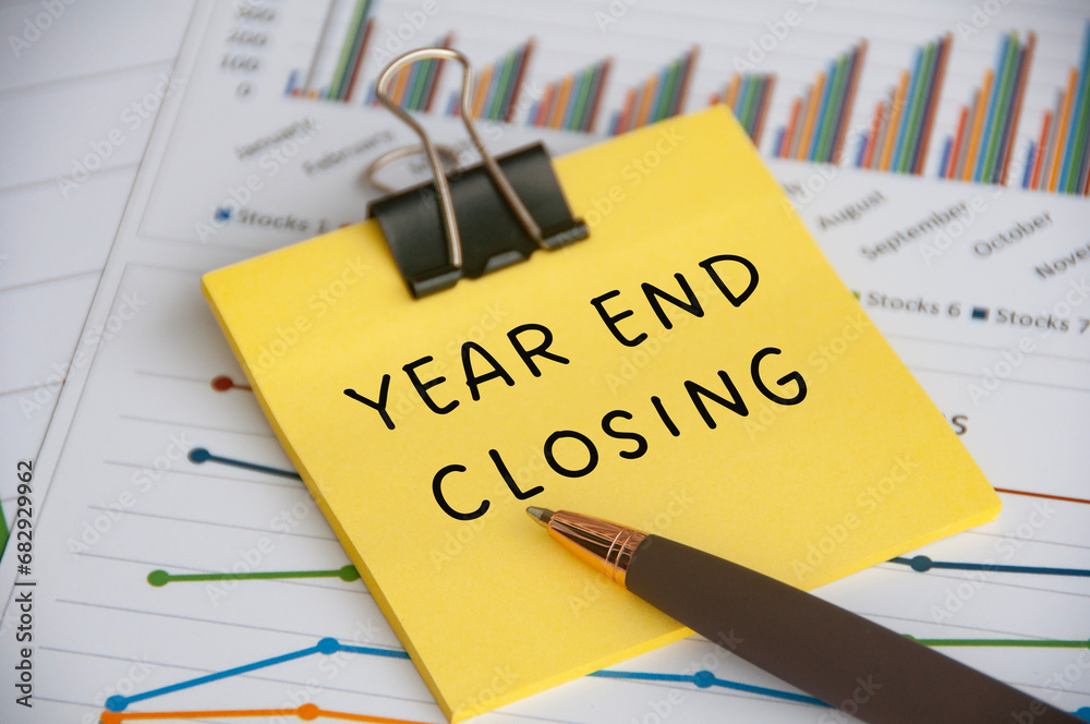 Year End Closing text on sticky note with statistic and graph ...
