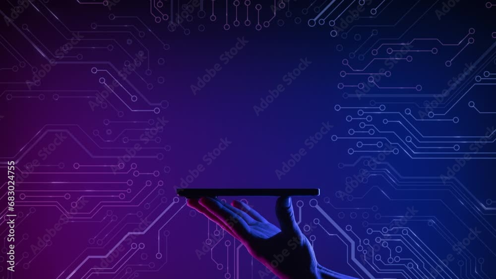 A hand holding smartphone on the PCB printed circuit board background ...