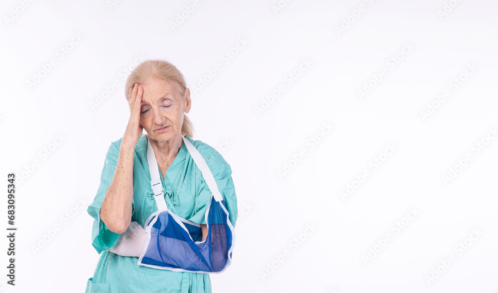 Disease upset injured elderly woman patient gown broken arm cast ...