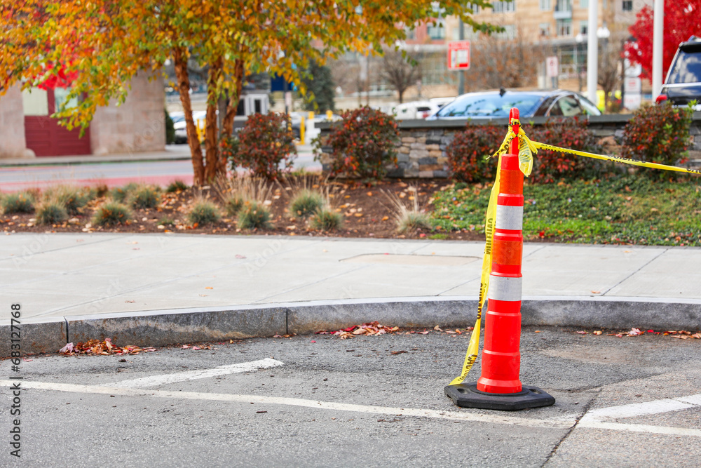 orange construction cones line the urban street, symbolizing safety ...