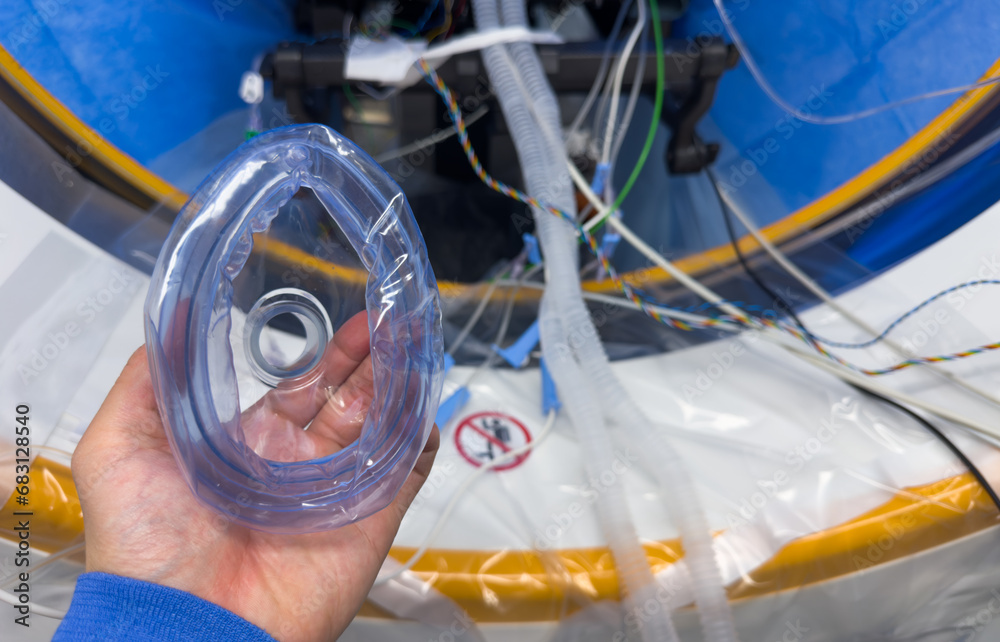 medical professional using airway equipment, mask, laryngoscope, and ...