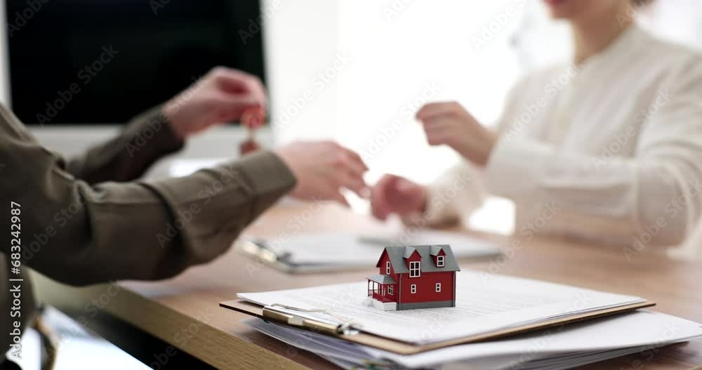 Successful business deal real estate agent and new homeowner exchange ...