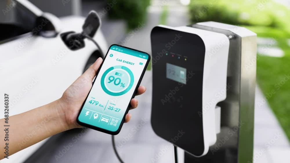 Smartphone display battery status on smart EV mobile application while ...