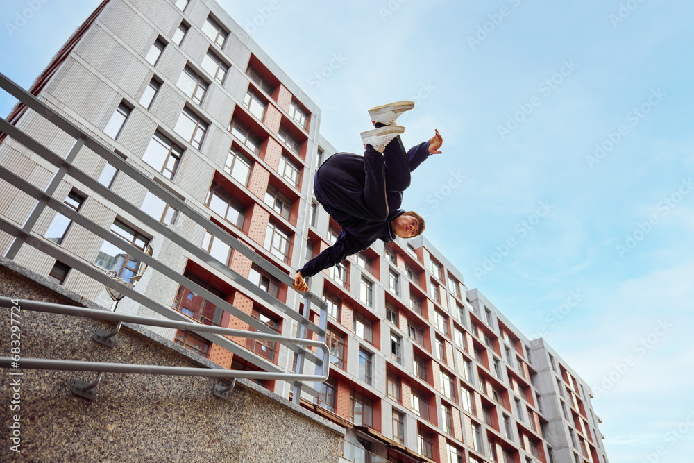 Gymnast, athlete man, young guy jumping, flips of wall, practice ...