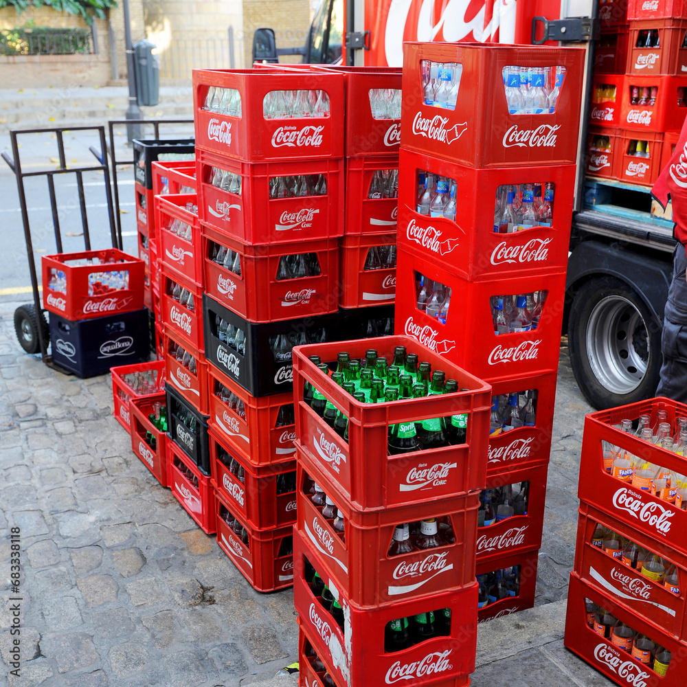 Collection of boxes of empty Coca Cola bottles and other drinks in bars ...