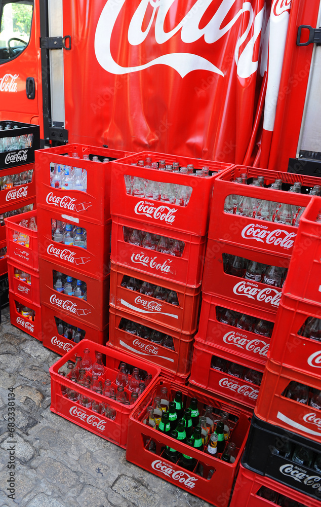 Collection of empty Coca Cola bottles for reuse in the factory. Coca ...