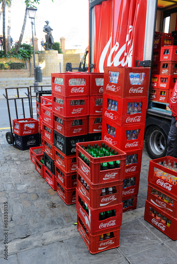 Collection of empty Coca Cola bottles for reuse in the factory. Coca ...
