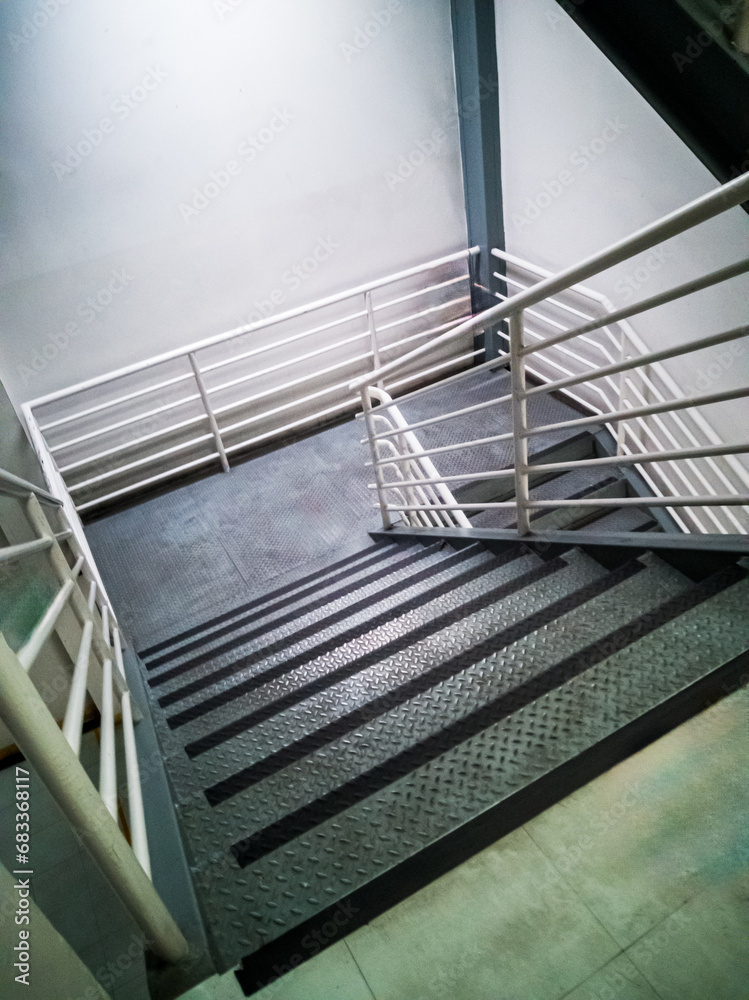 Photograph of a fire escape staircase, inside a building, of a tall ...