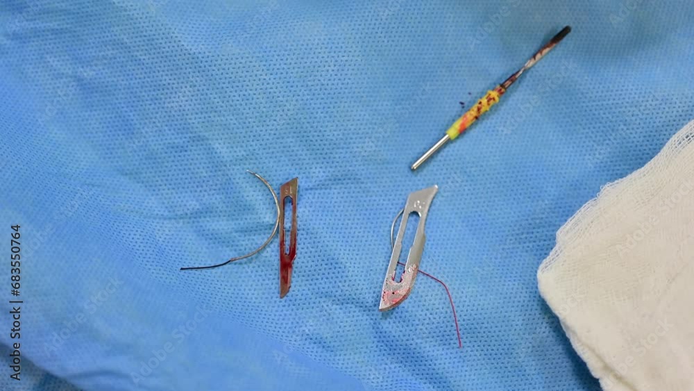 Scalpel and suture thread used in herniated disc surgery Stock Video ...