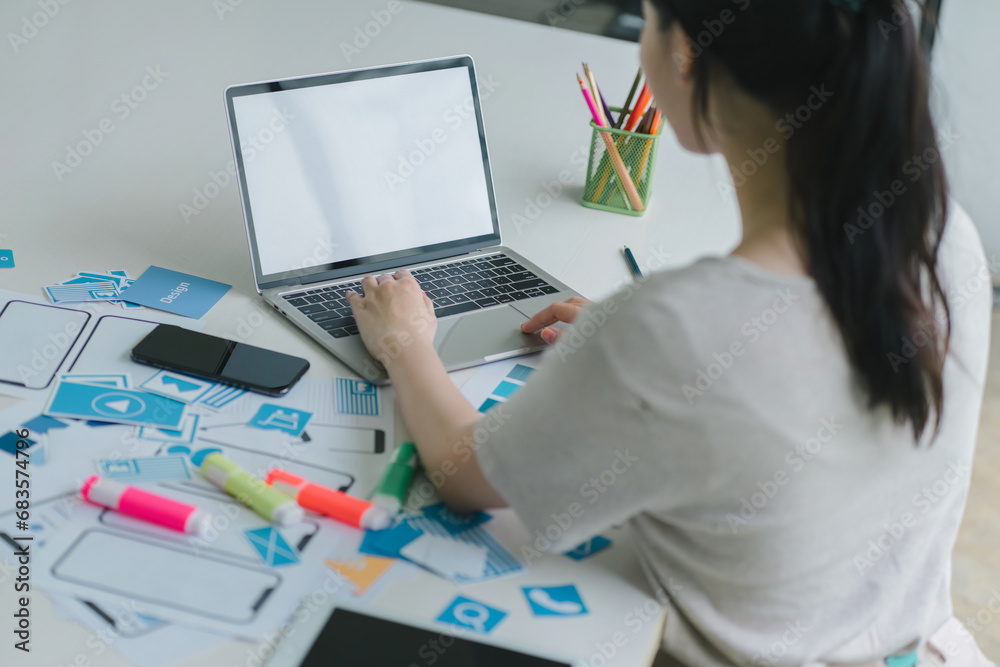 Creative UX UI designer working on screens for mobile responsive ...