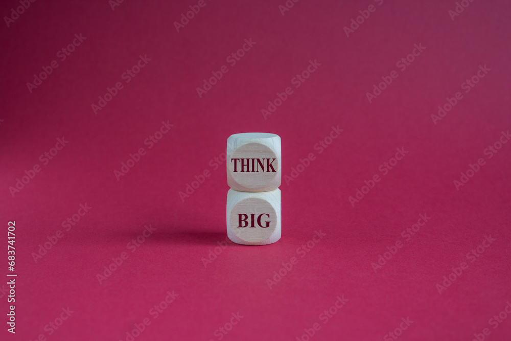 Think big symbol. Wooden cubes with words Think big. Beautiful red ...