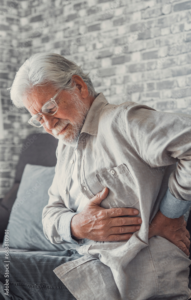 Upset senior elder man feel sudden back pain muscles ache tension ...