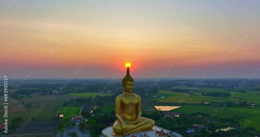 .aerial view The sun was above the head of the biggest golden Buddha at ...