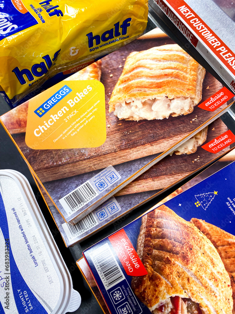 A box of frozen Gregg's chicken bakes on a a conveyor belt at a ...