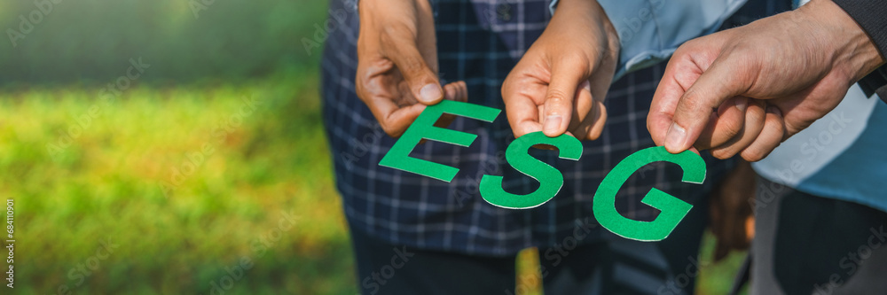 ESG concept ,Sustainable teamwork and partnership Hands Shoe ESG word ...