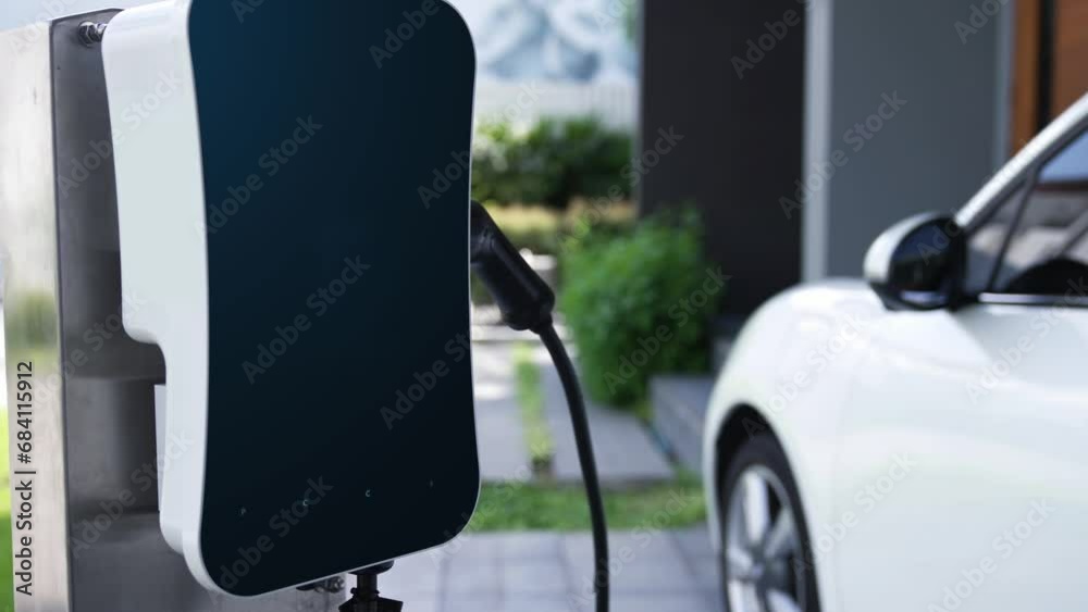 Electric car recharging from home charging station by futuristic EV ...