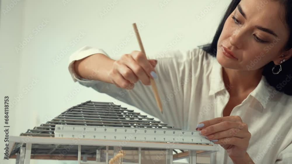 Professional young beautiful architect engineer using ruler and pencil ...