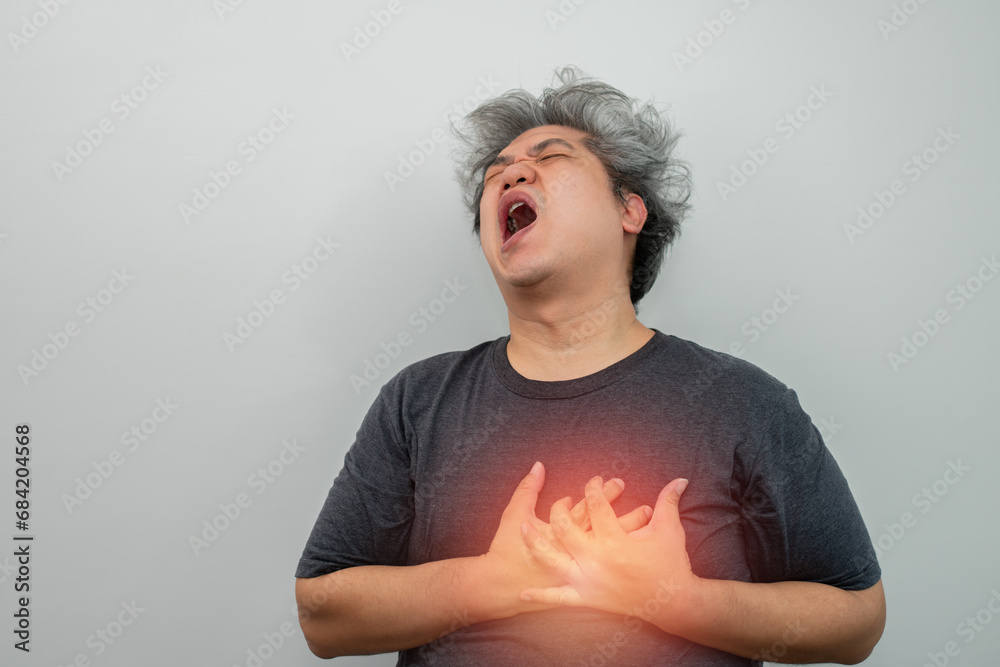 Man clutching his chest from acute pain and suffering from chest pain ...