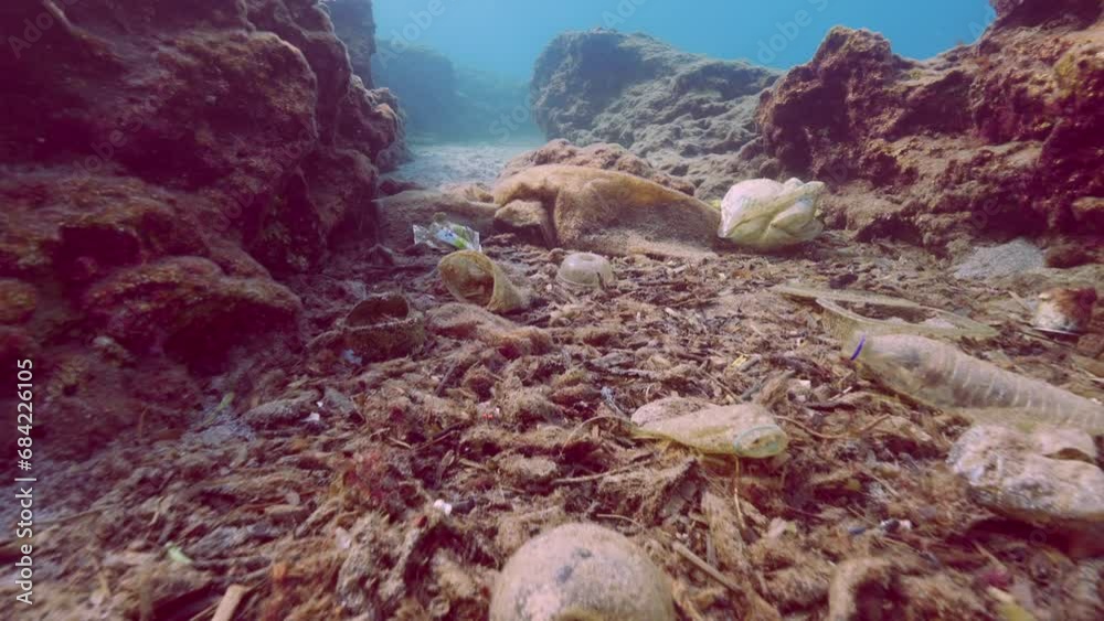 Camera moving backwards between rocks revealing view of massive ...