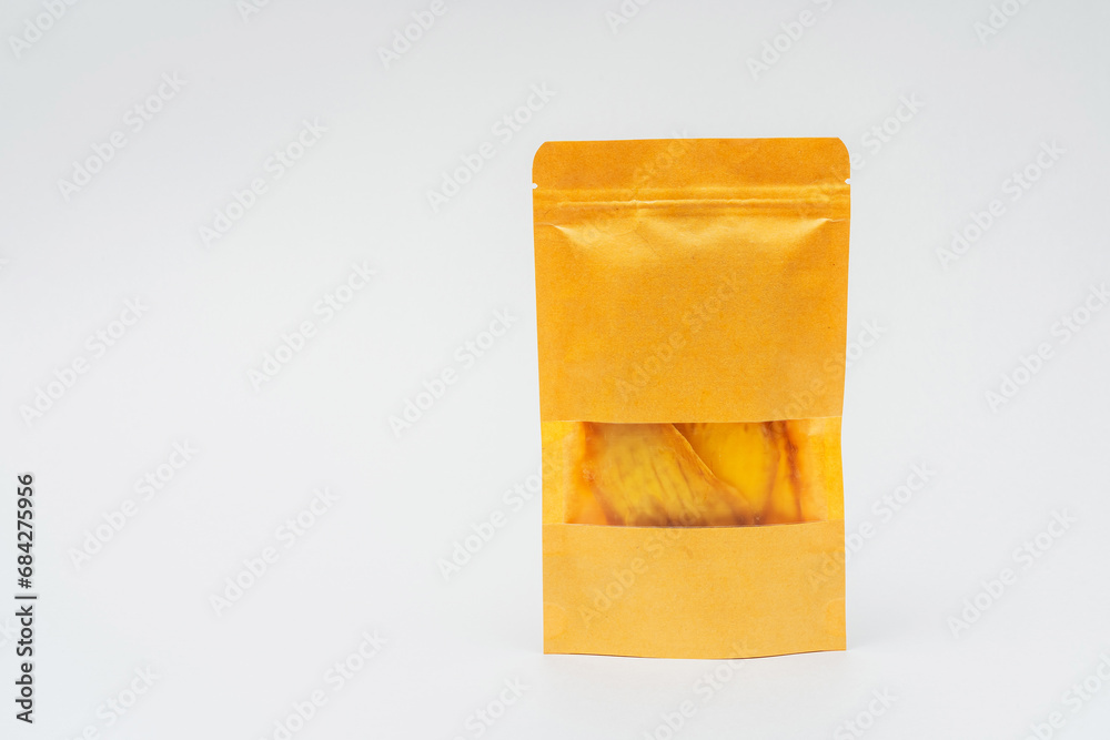 dried mango slices in a bag on a white background. dehydrator-dried ...