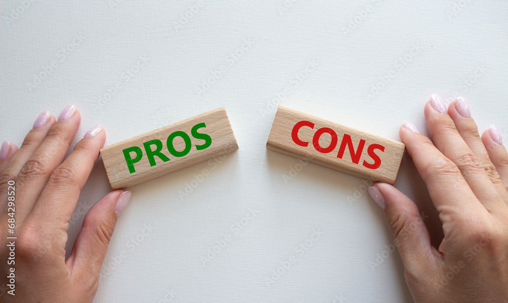 Pros vs Cons symbol. Concept word Pros vs Cons on wooden blocks ...