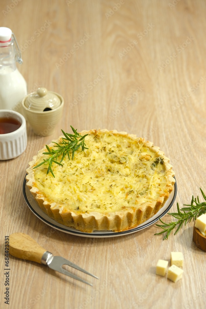 Quiche lorraine on the tablebackground. Rosemary for garnish. Breakfast ...