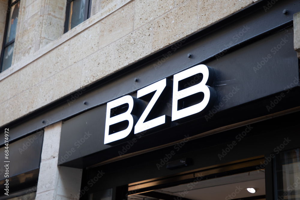 bzb bizzbee shop sign text and brand logo on facade chain entrance ...