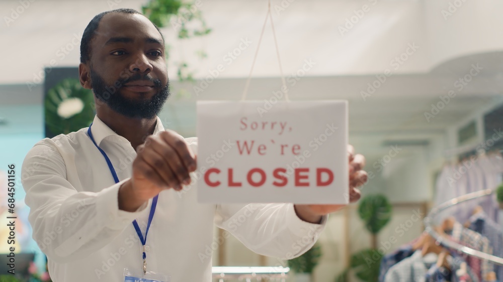 BIPOC man closing down store in order to do restocking in elegant high ...