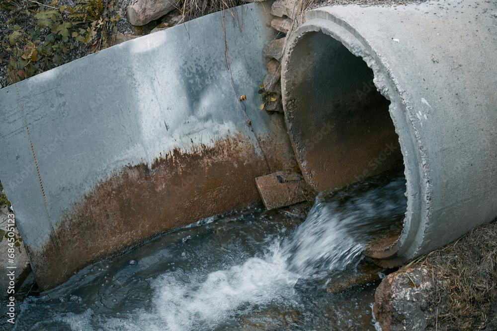 Draining sewage from a pipe into the river. Concept of pollution rivers ...